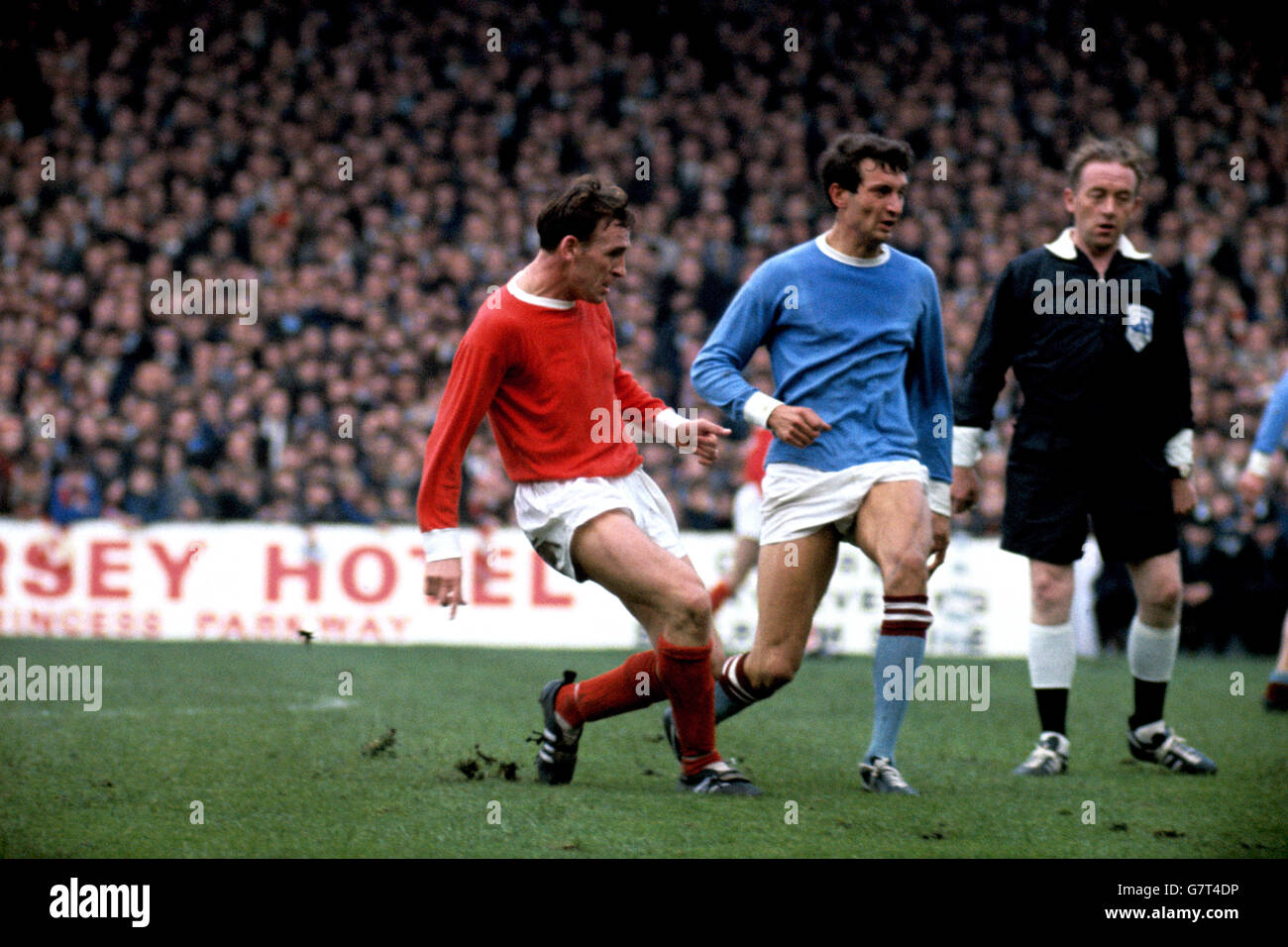 (L-R) Manchester United's Pat Crerand plays the ball forward before ...