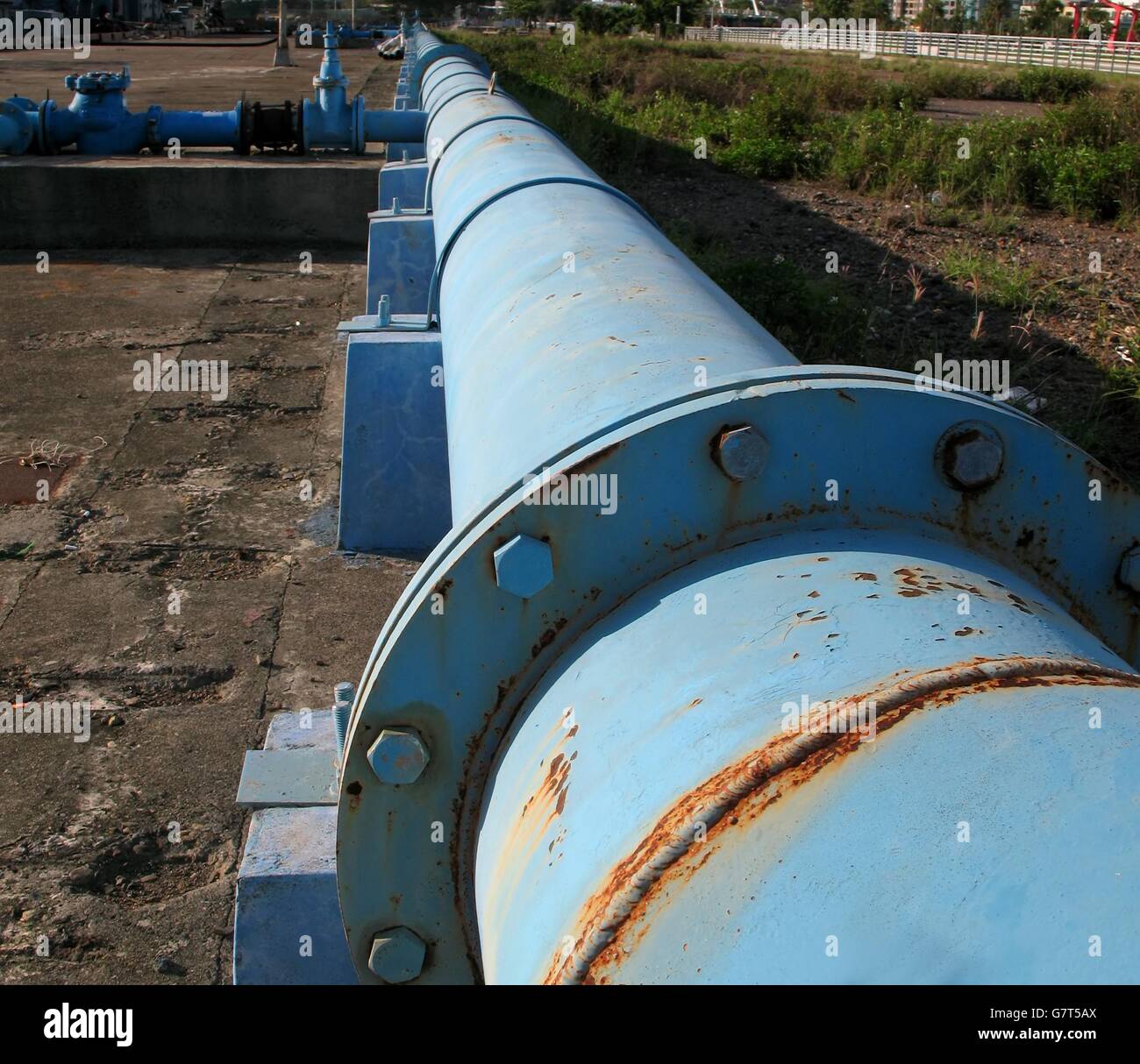 Pipeline with a connecting point and various valves Stock Photo - Alamy
