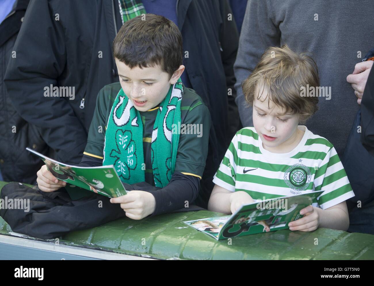 Children fans read match day programme during the Scottish Championship ...
