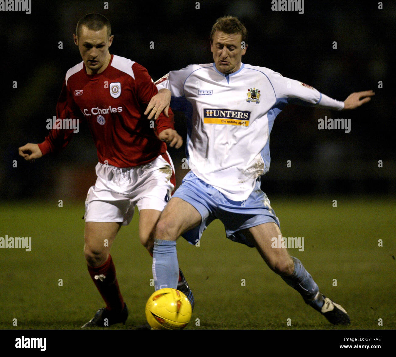 Crewe Alexandra's Kenny Lunt (L) tussles for the ball with Burnley's ...