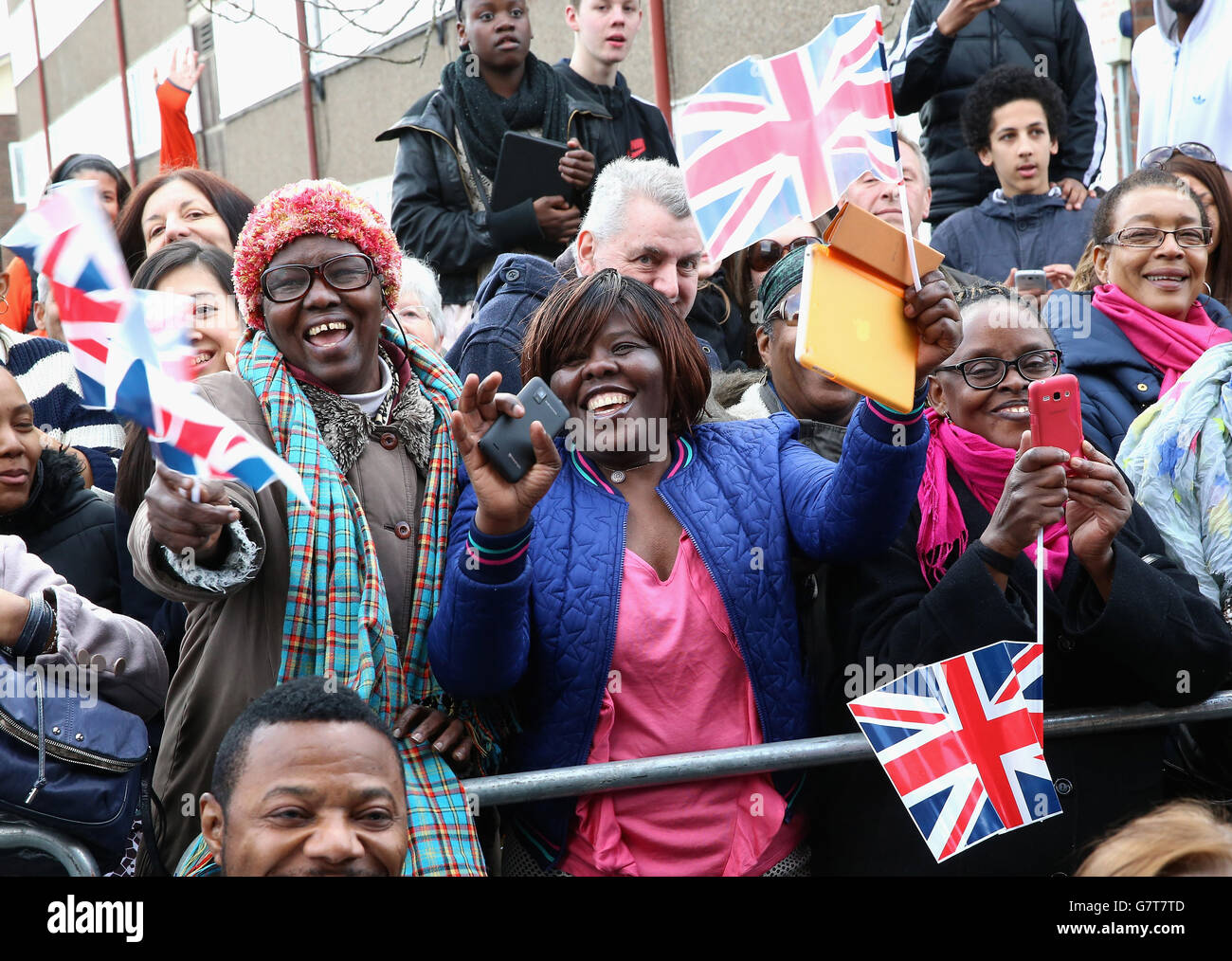 The crowd cheer as the Duke and Duchess of Cambridge arrive for their ...