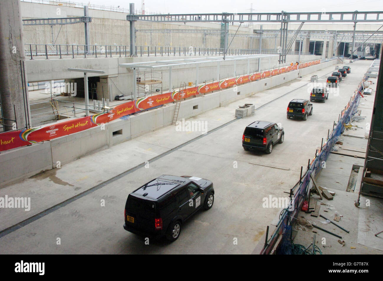 Delegates from the IOC are driven by Land Rover through the Channel ...