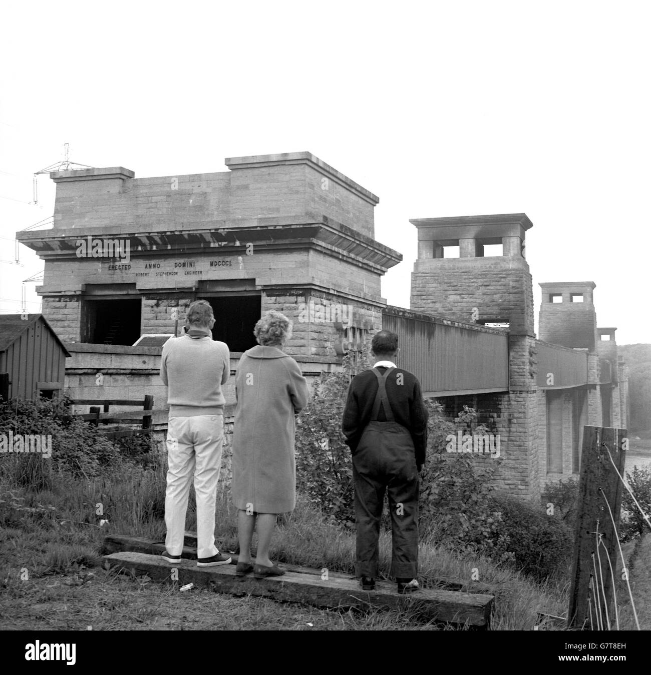 Fire blackened is the tubular Britannia Bridge over the Menai Straight ...