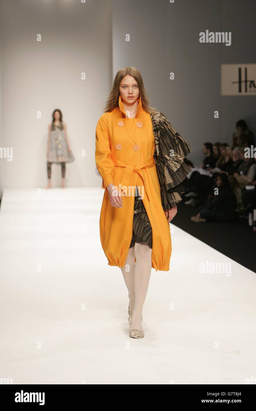 Fashion model modelling catwalk yellow raincoat hi-res stock ...