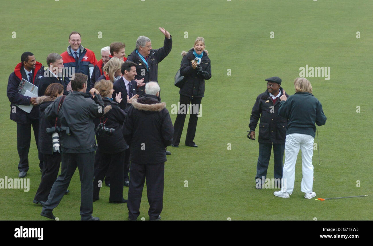 South African Sam Ramsamy is congratulated after being shown by an ...
