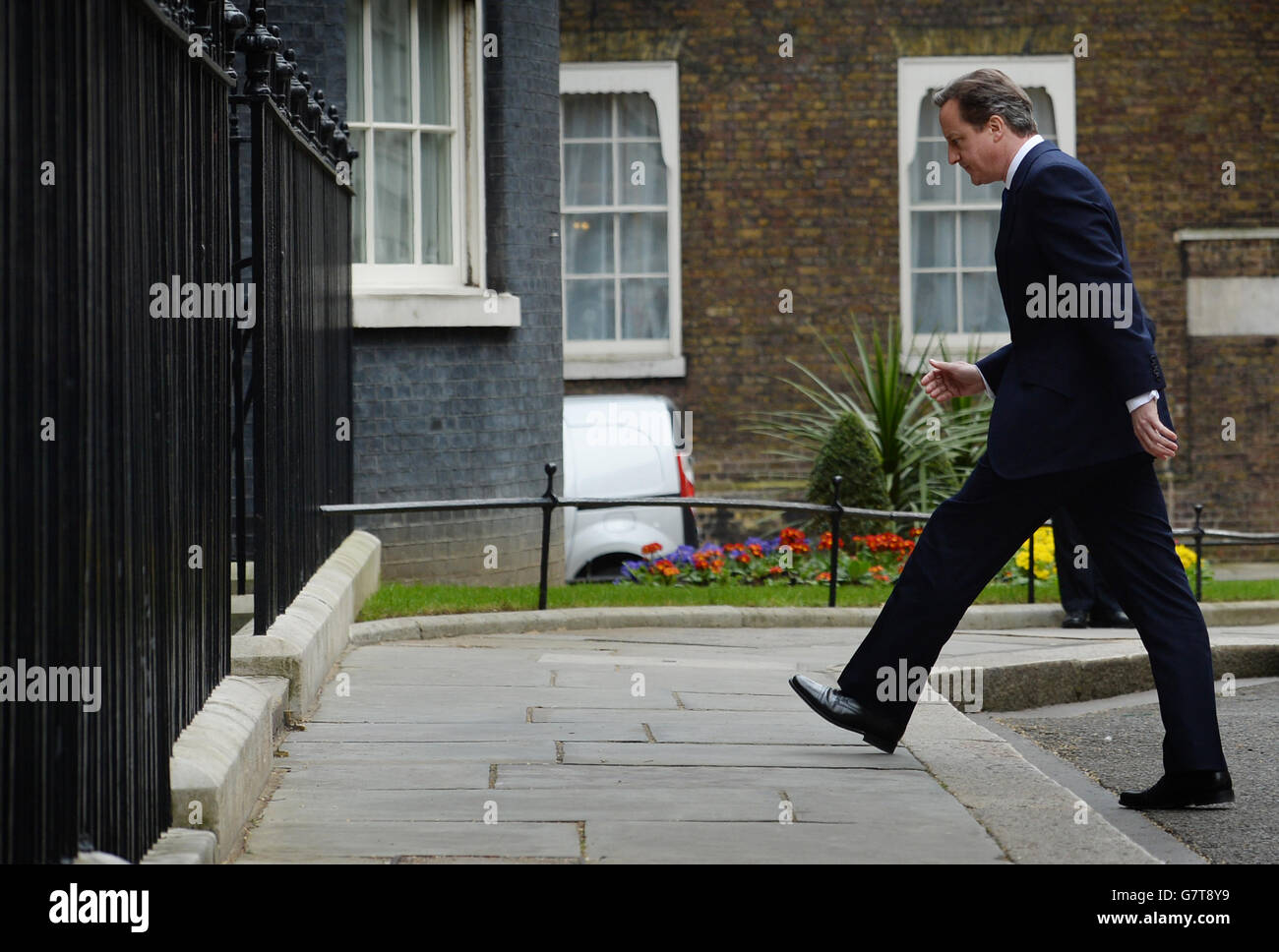 Prime Minister David Cameron walks back into 10 Downing Street, London ...