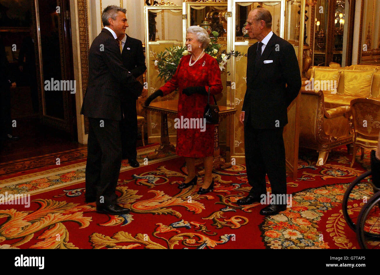 Jonathon Edwards is greeted by Britain's Queen Elizabeth II and the ...