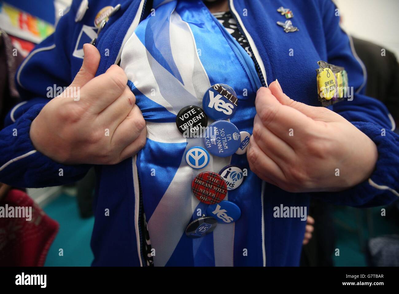 An SNP supporter shows off her badges after First Minister Nicola ...