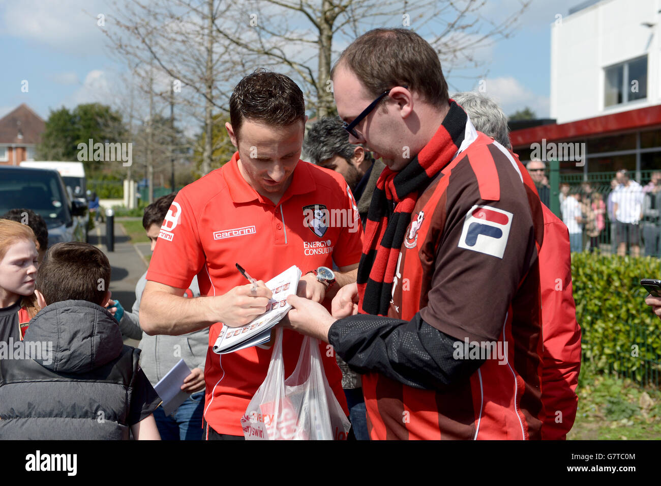 Bournemouth's Marc Pugh signs autographs for fans outside the ground ...