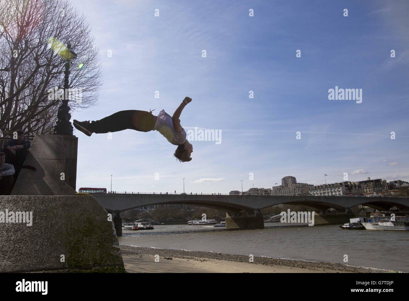 Free-runner Aiden Knox,15, performs a flip from the South Bank, London ...