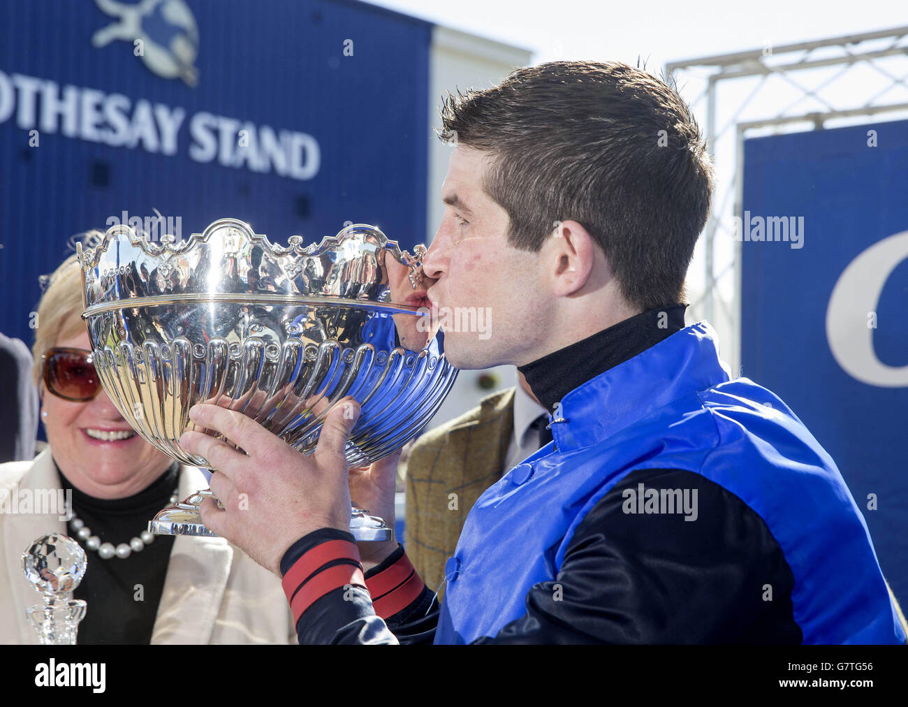 Robert Dunne celebrates after winning the Coral Scottish Grand National ...