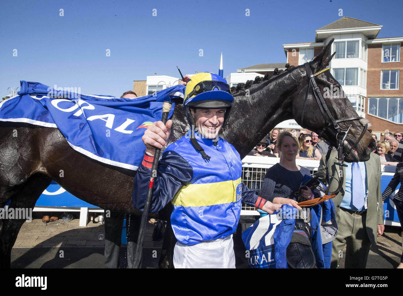Robert Dunne celebrates after winning the Coral Scottish Grand National ...