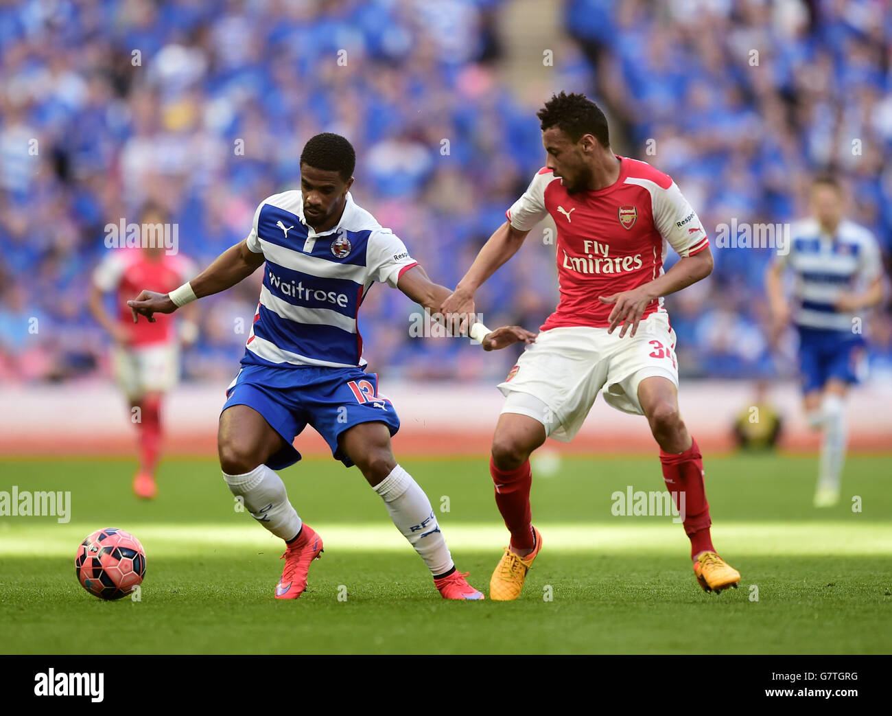 Reading's Garath McCleary battle for the ball with Arsenal's Francis ...