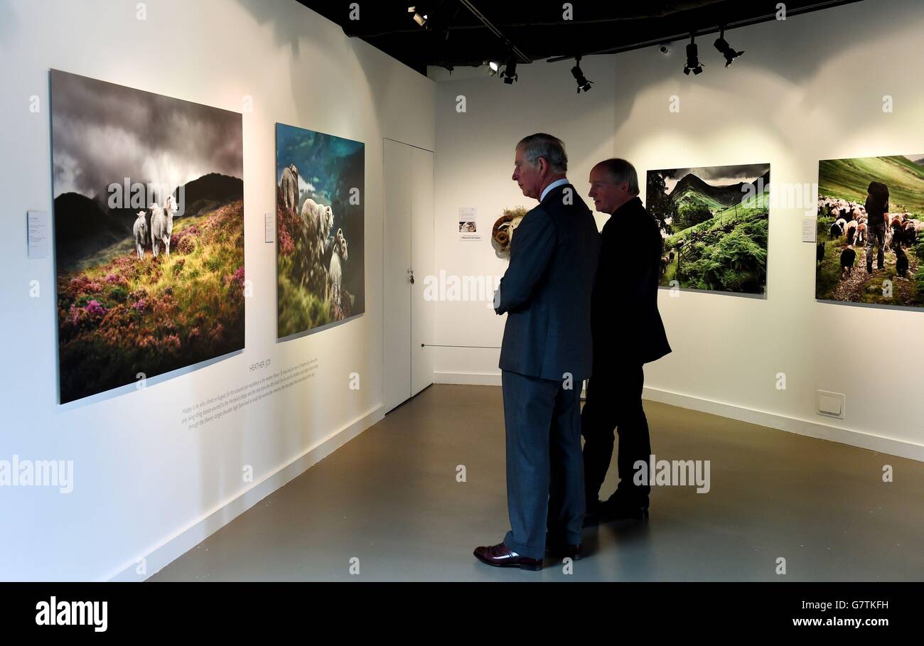 The Prince of Wales speaks with photographer Ian Lawson (right) as he ...