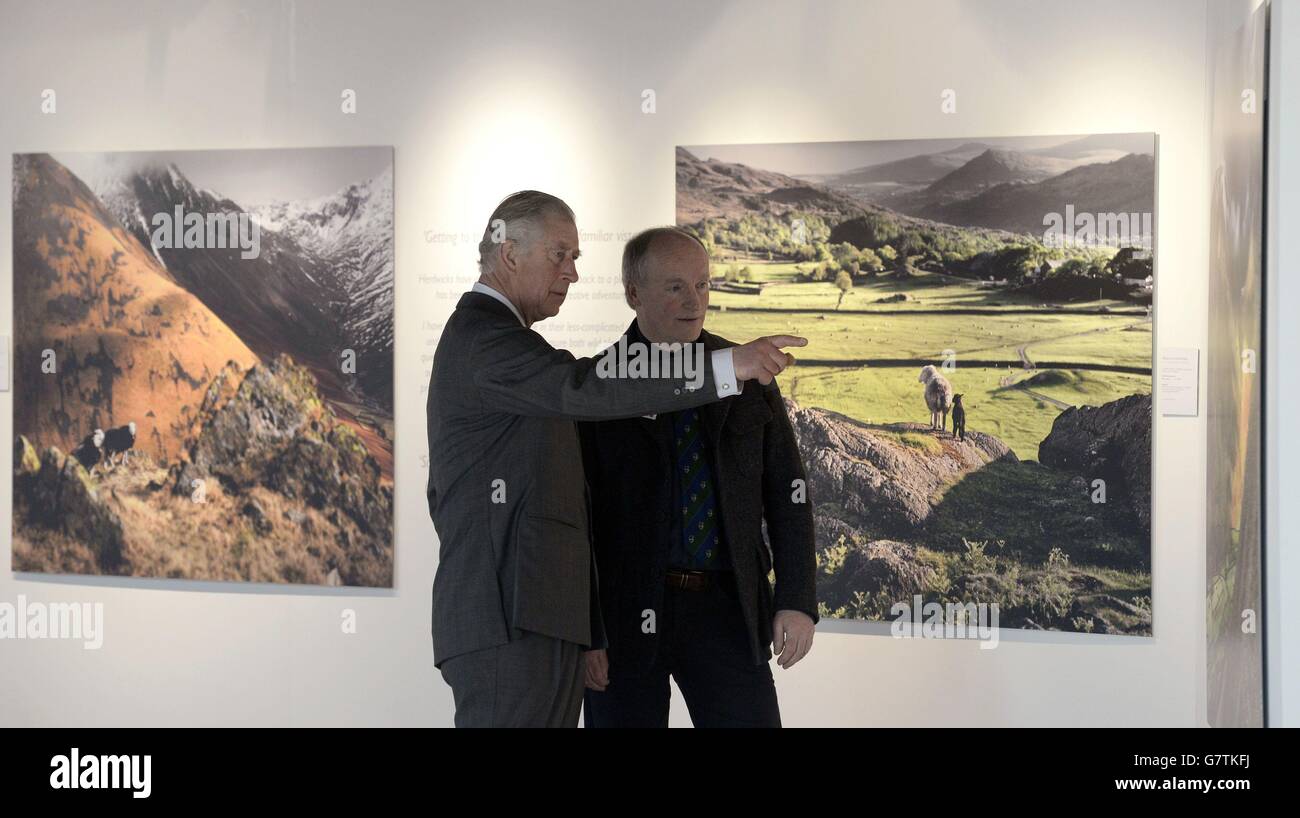 The Prince of Wales speaks with photographer Ian Lawson (right) as he ...