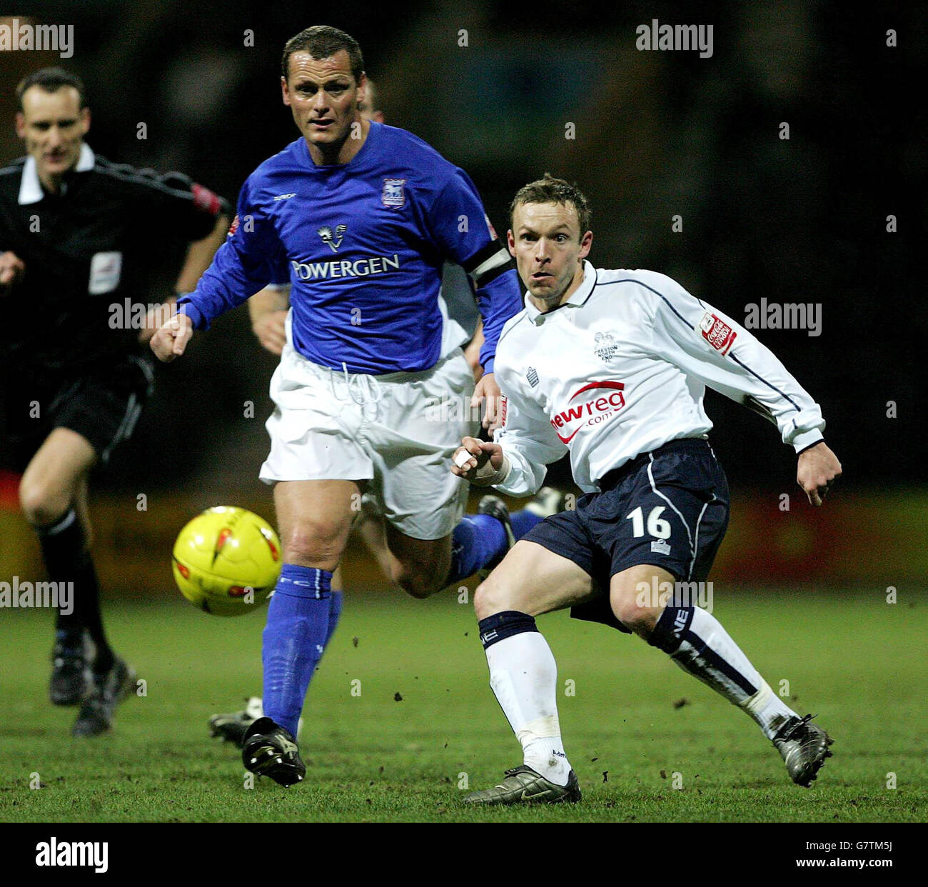 Preston's Paul McKenna passes the ball as Ipswich Town's Jason De Vos ...