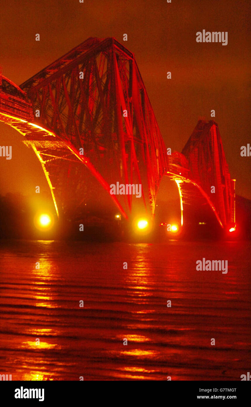 The Forth Bridge near Edinburgh, illuminated with red lights ahead of ...