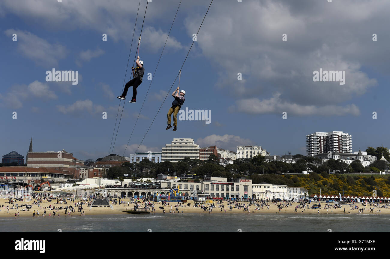 Two members of the public use the Bournemouth Pier Zip wire as they ...