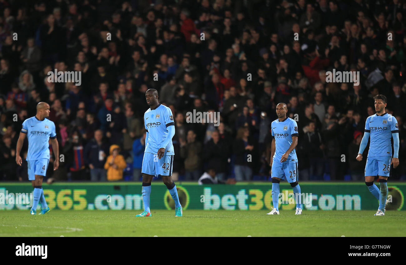 Manchester City players look dejected after seeing their side concede a ...