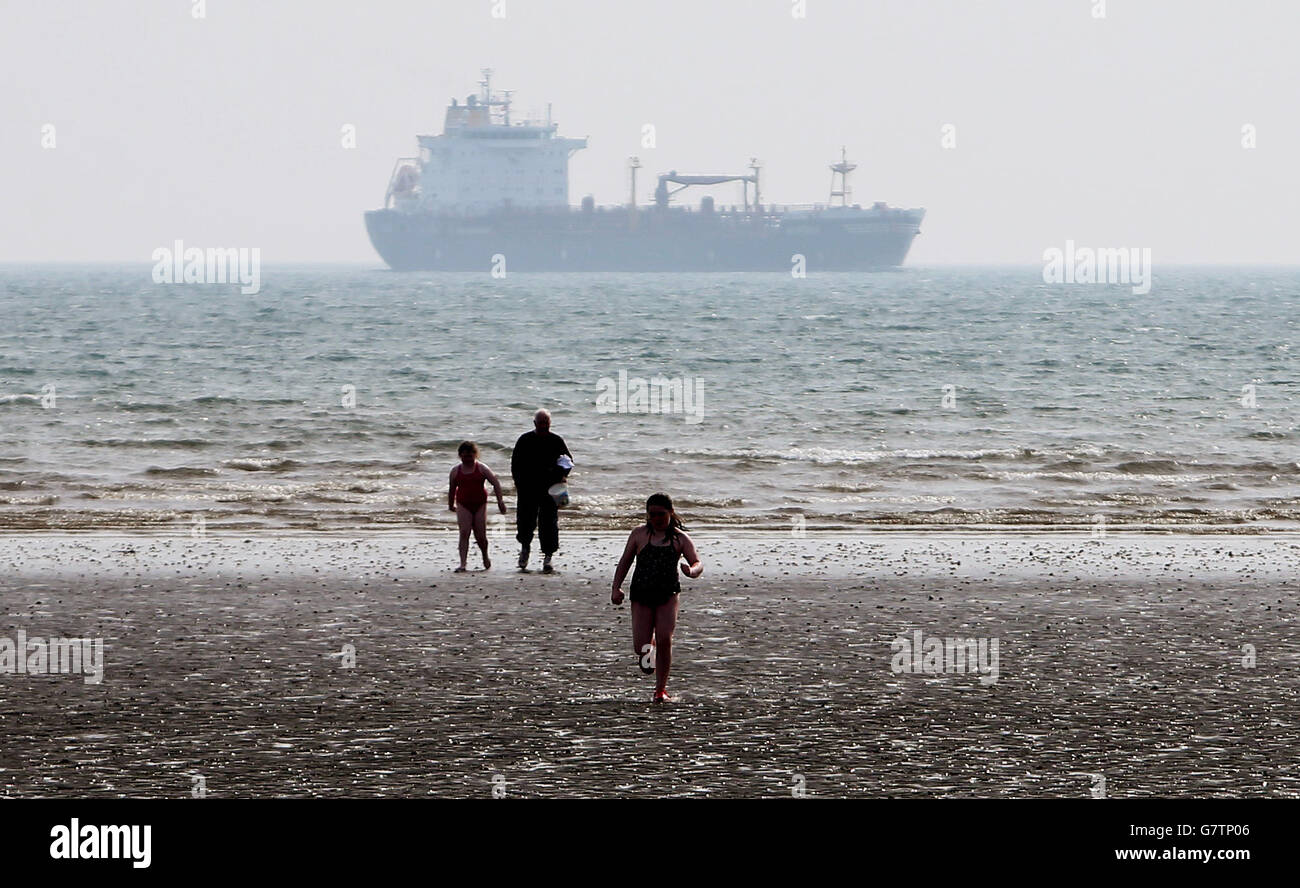 People on Dollymount strand in Dublin during the warm April weather ...