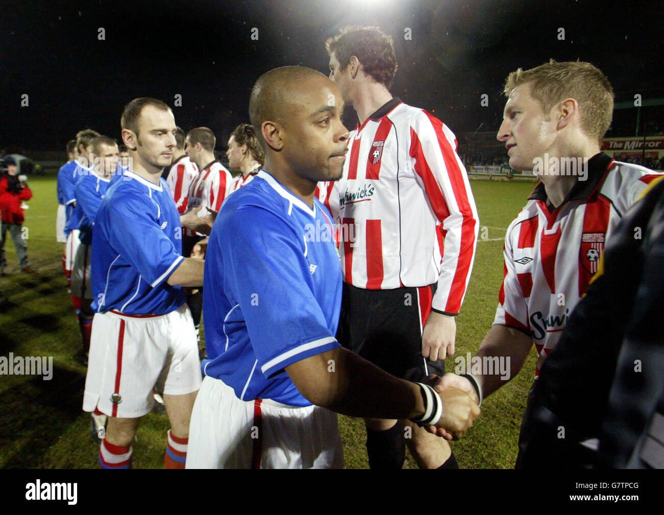Linfield players (blue) are welcomed during a friendly match. The two ...