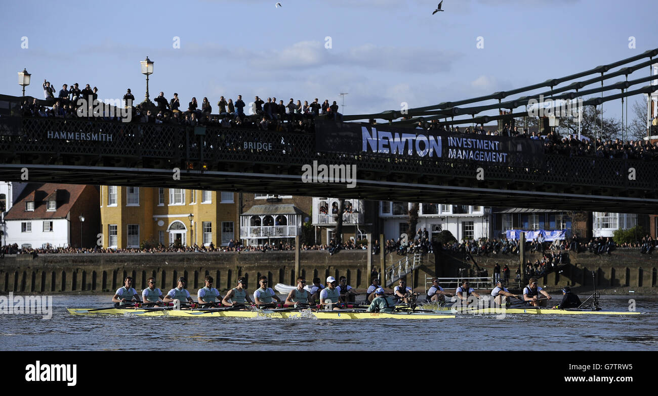 The Cambridge boat (left) and Oxford boat make their way under ...