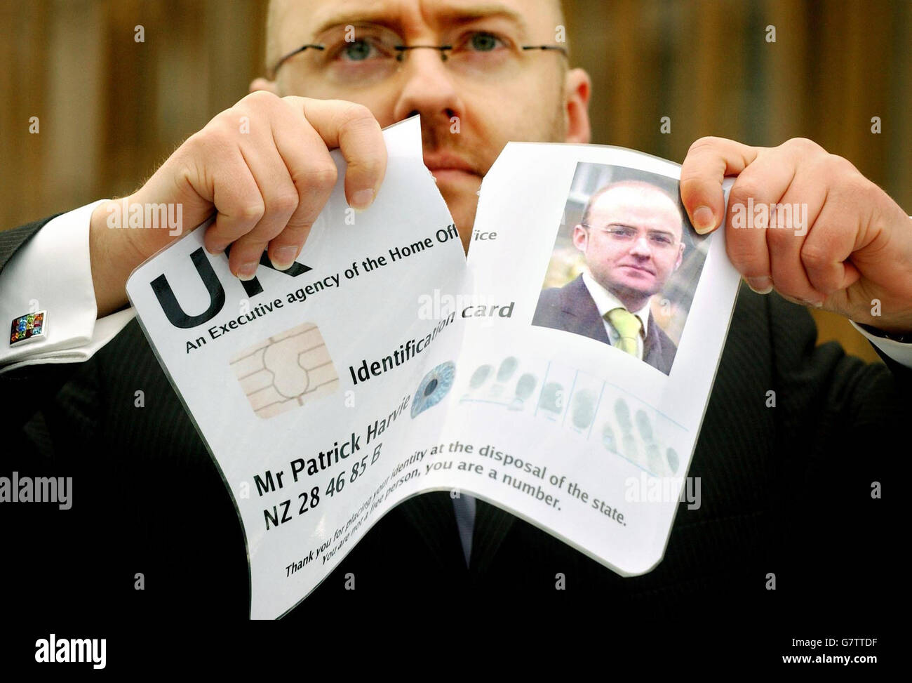 Scottish Green Party justice spokesman Patrick Harvie tears up a mock ...