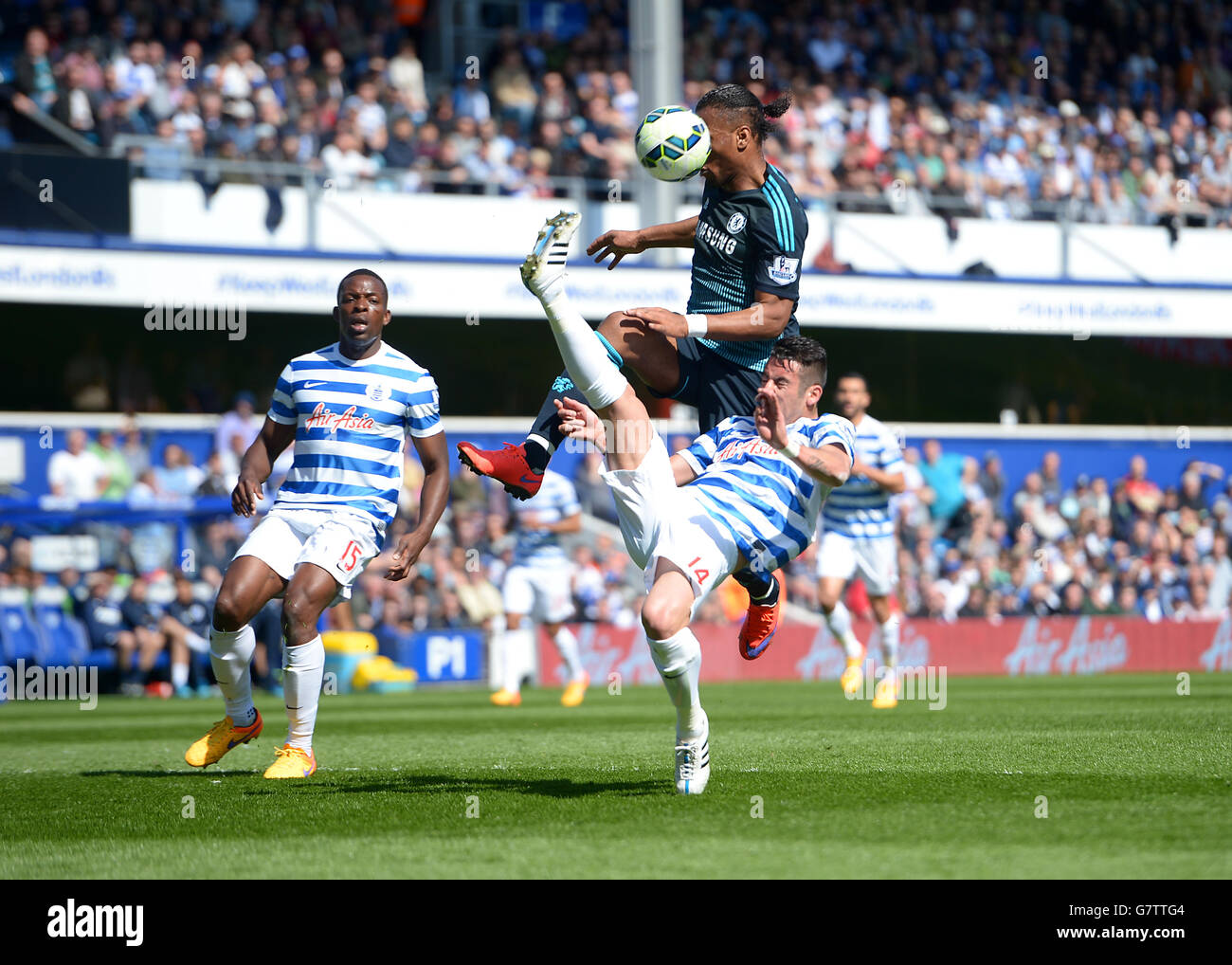Chelsea's Didier Drogba and Queens Park Rangers' Mauricio Isla battle ...