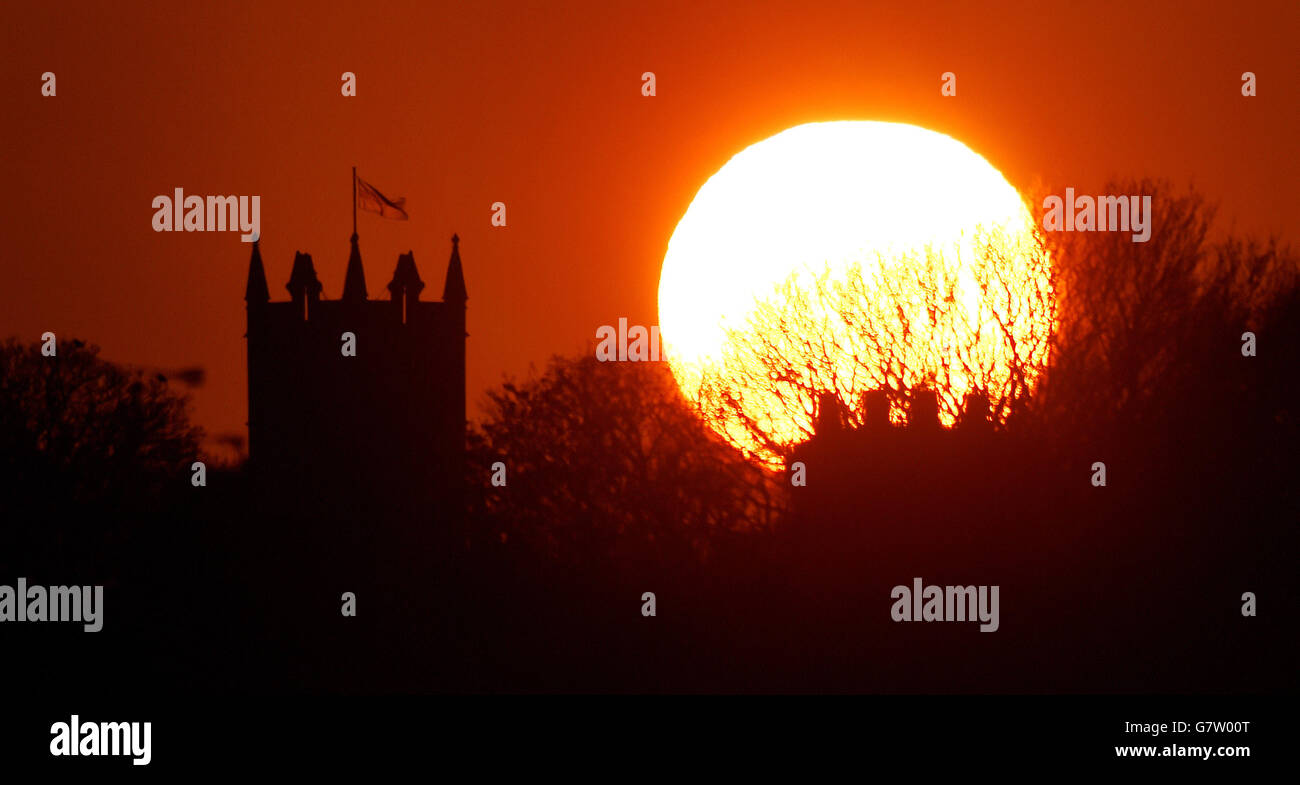 The sun balances next to st albans church in earsdon hi-res stock ...