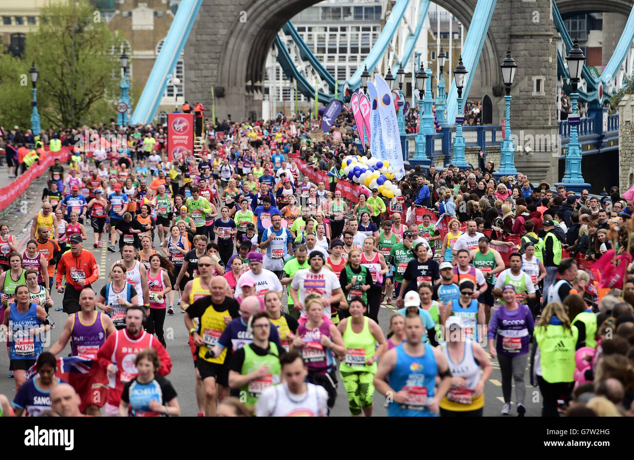 A marathon runners make their way over Tower Bridge during the 2015 ...