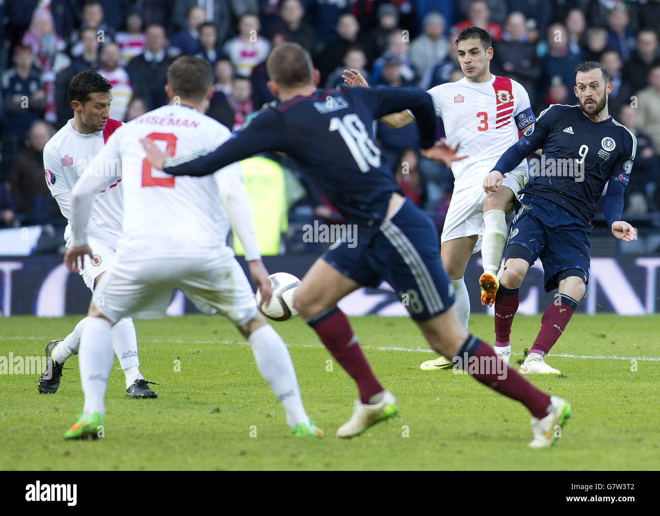 Scotland's Steven Fletcher (right) scores to complete his hat-trick ...