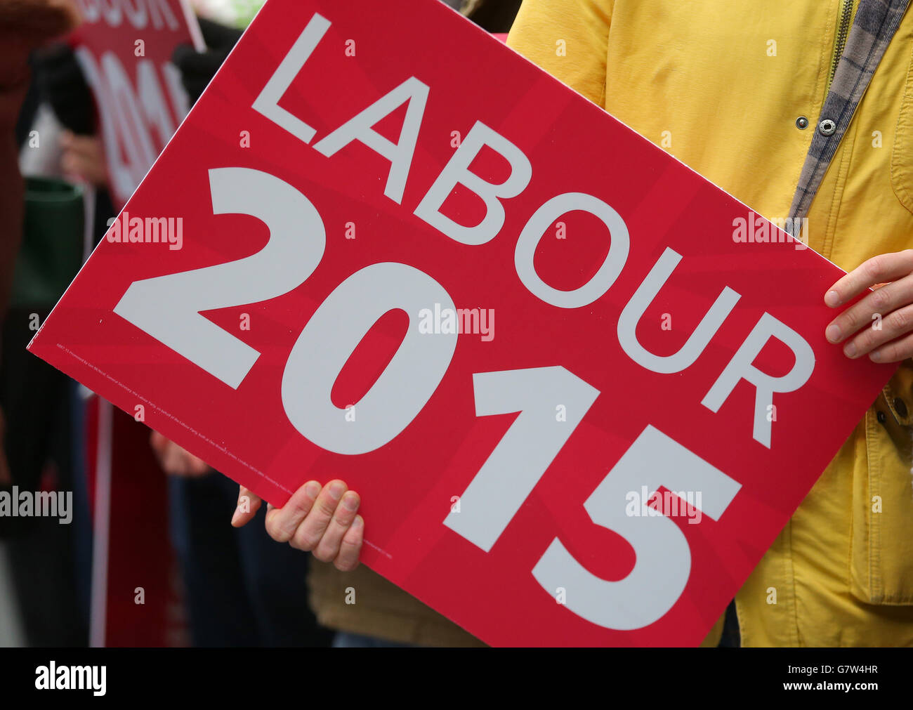 Labour Party supporters hold placards before the arrival of leader Ed ...