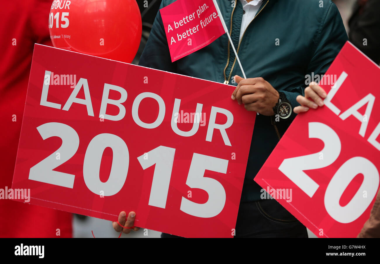 Labour Party supporters hold balloons and placards before the arrival ...
