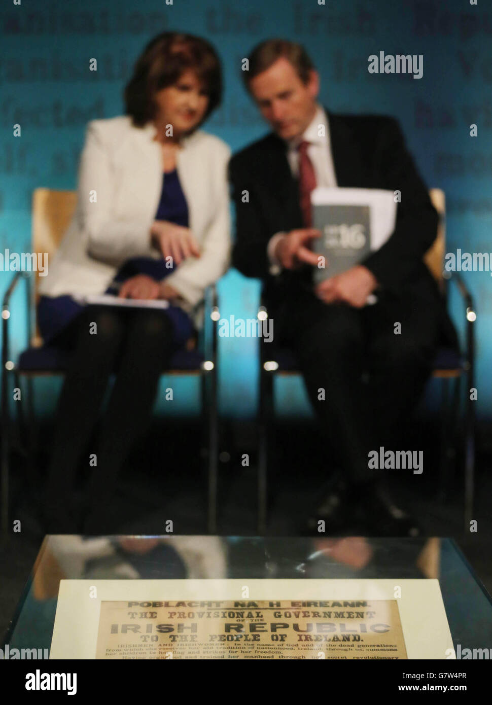 Tanaiste Joan Burton and Taoiseach Enda Kenny look at a copy of 1916 ...