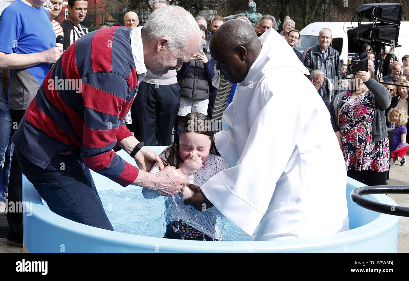 The Archbishop of York Dr John Sentamu (right) baptises Amelia Scarlet ...