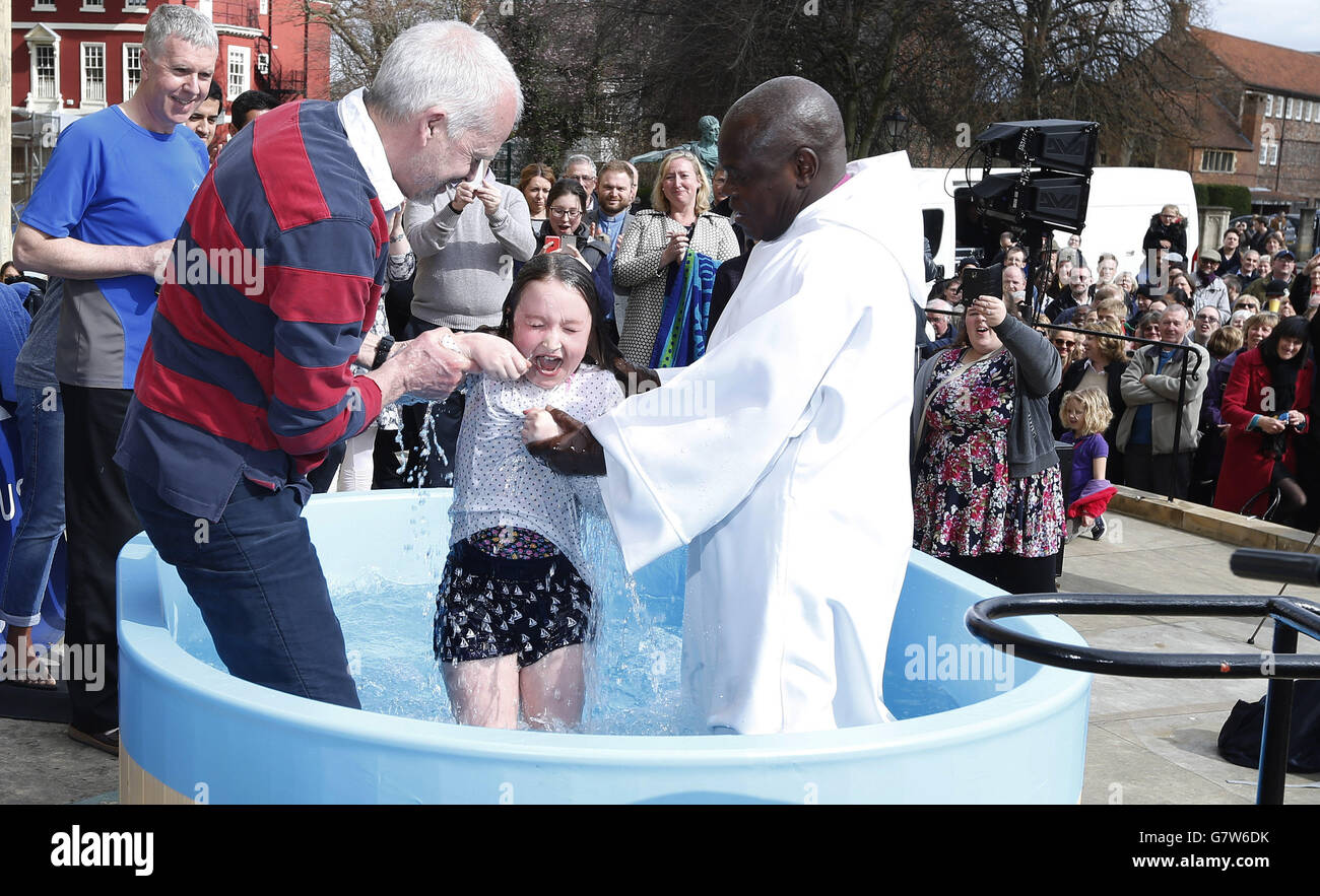 The Archbishop of York Dr John Sentamu (right) baptises Amelia Scarlet ...