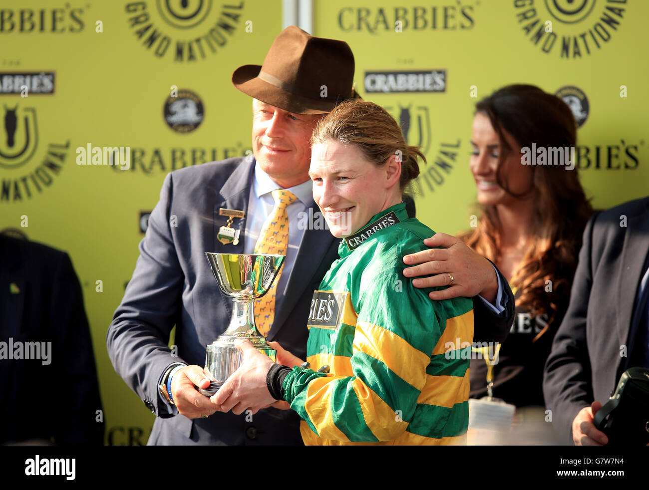 Jockey Nina Carberry is presented with her trophy after winning the ...