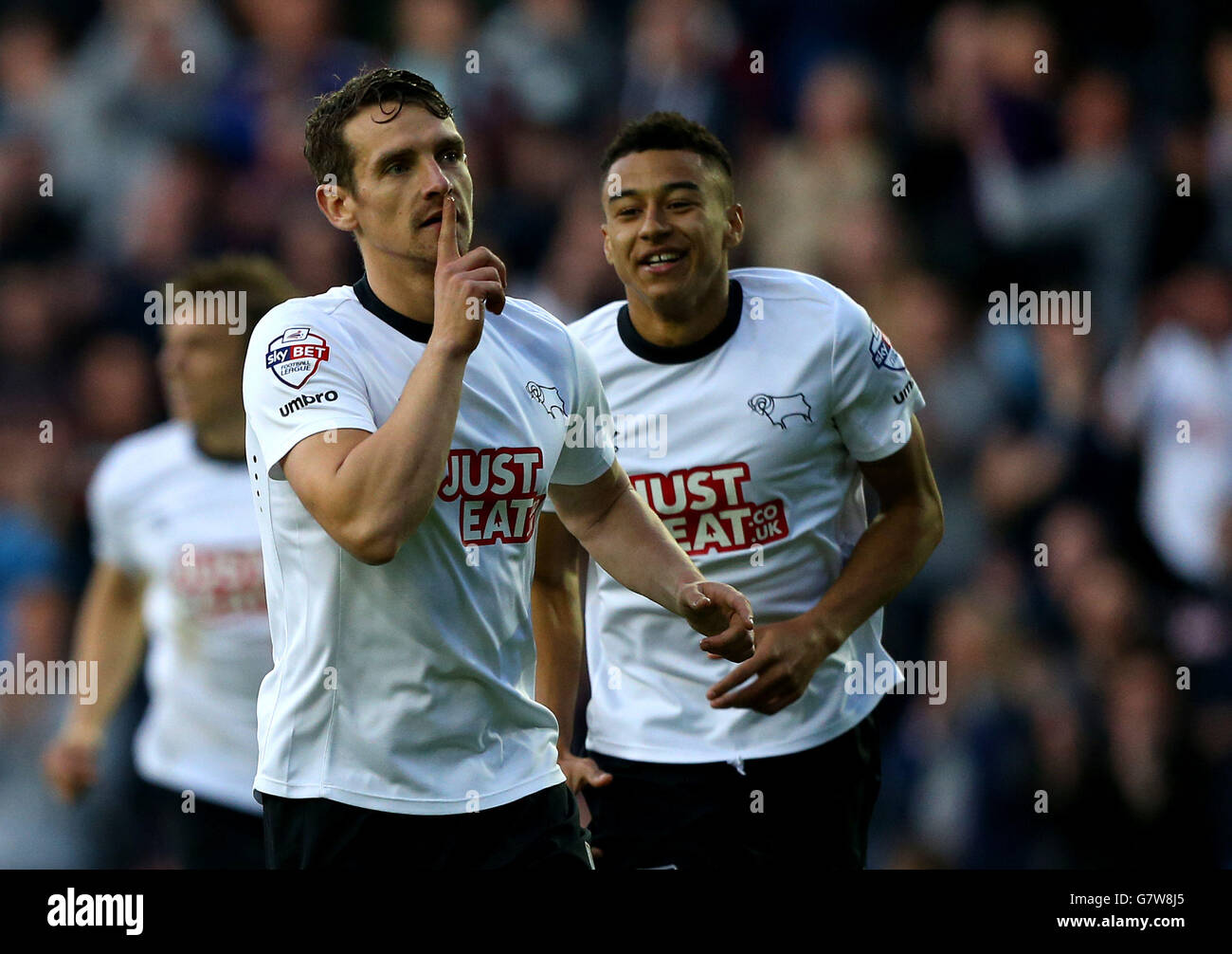 Derby County's Craig Bryson (left) celebrates scoring his sides first ...