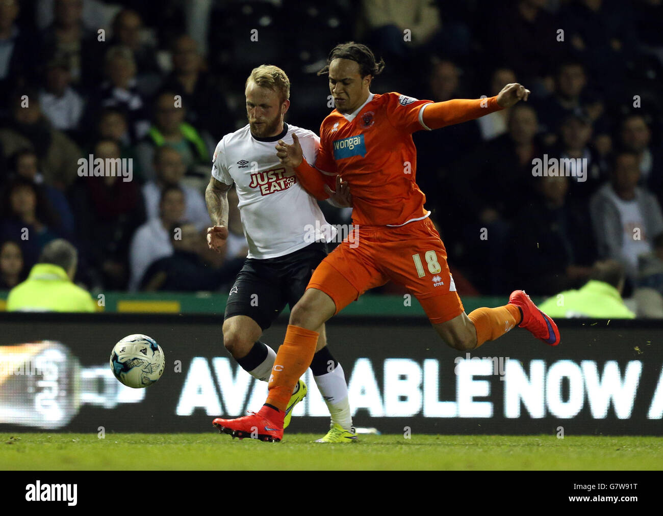 Blackpool's Charles Dunne (right) and Derby County's Johnny Russell ...