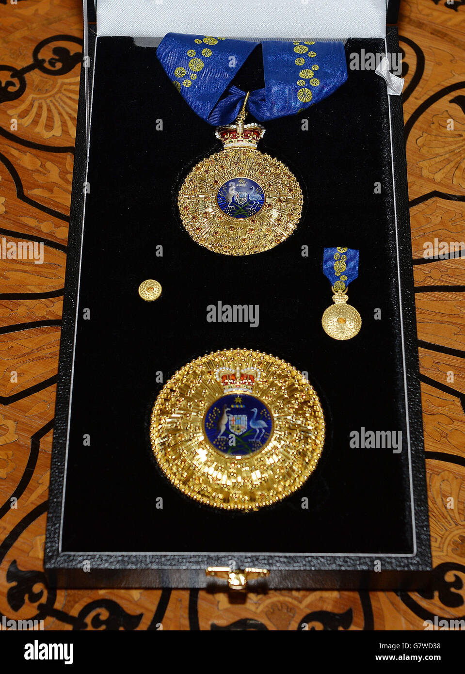 Queen presents Insignia of a Knight of the Order of Australia Stock ...