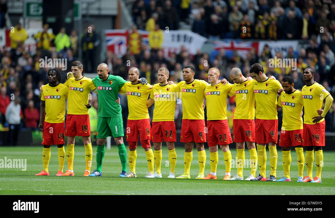 The Watford team observe a moments silence to mark the Bradford City ...