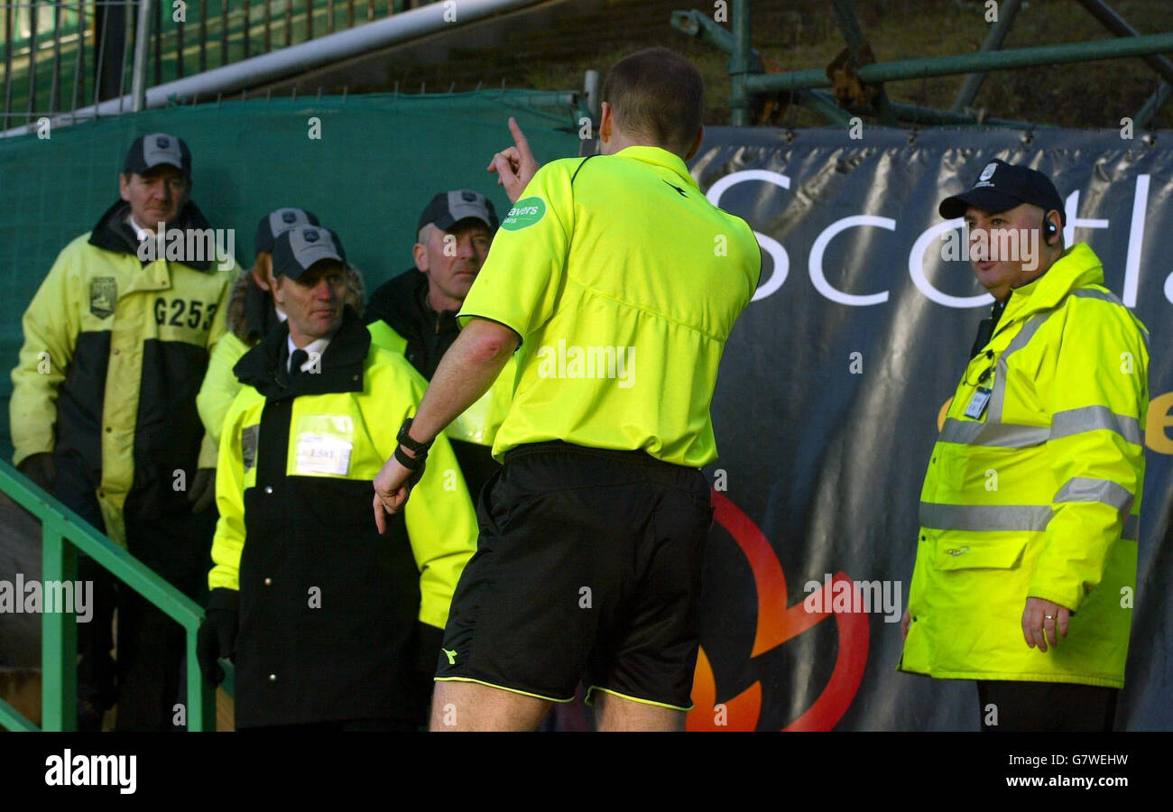 Referee kenny clark centre gestures to ground staff hi-res stock ...