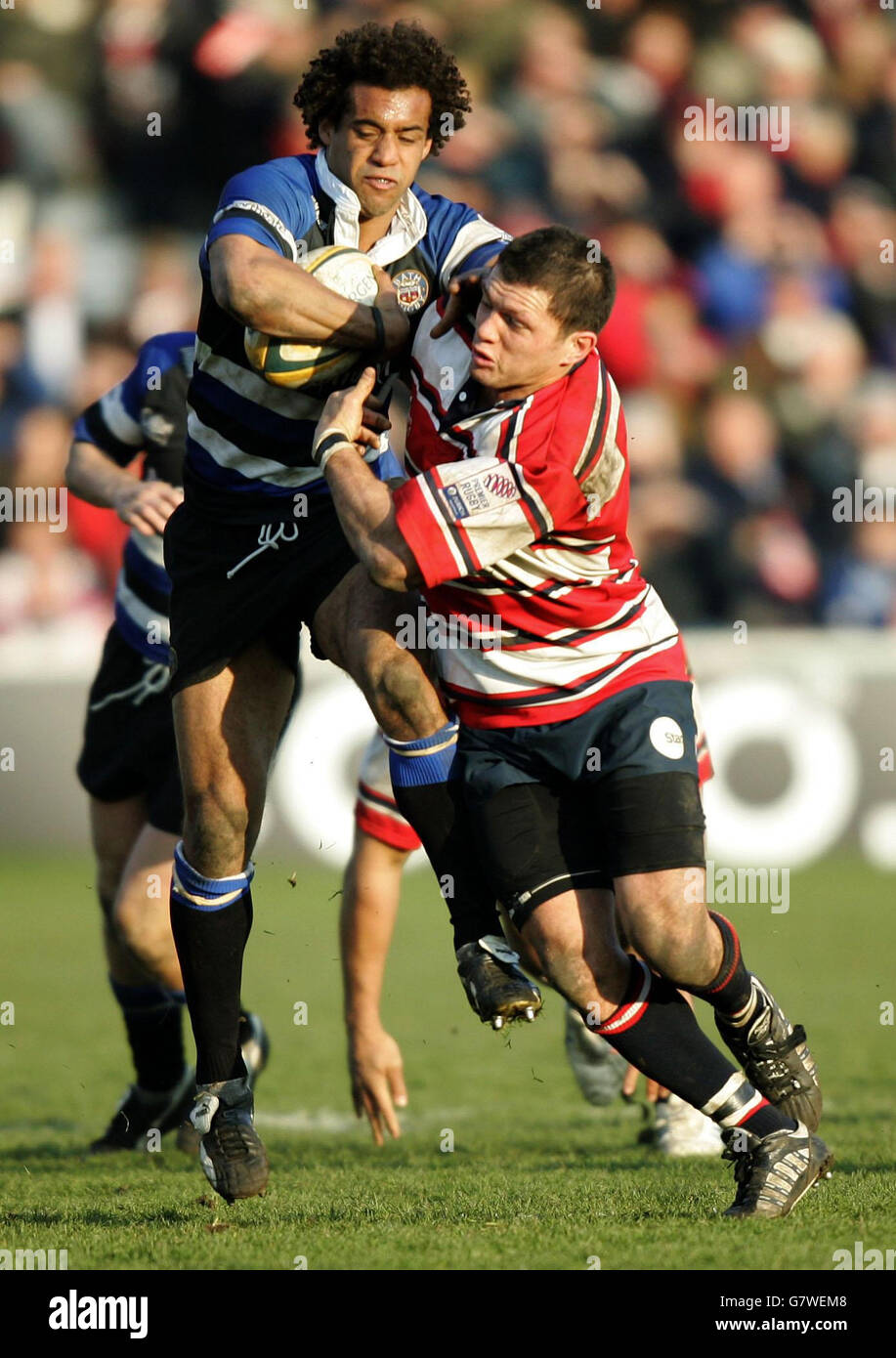 Bath's Andy Higgins (left) in action against Gloucester's Henry Paul ...