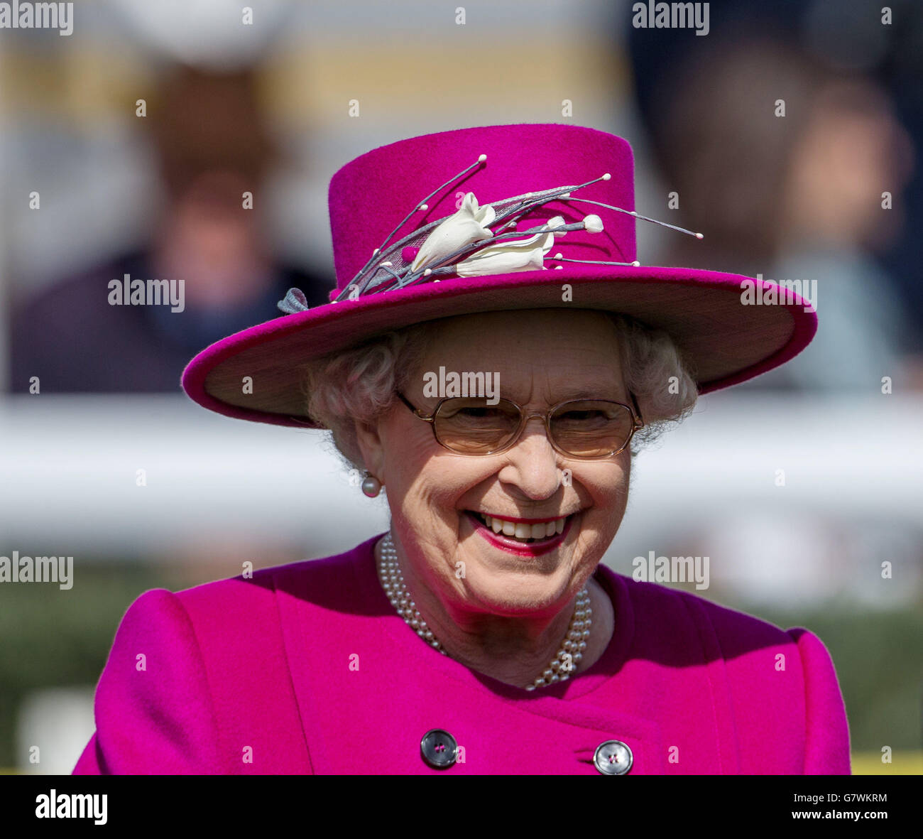 Queen Elizabeth II watches the horse racing at the Dubai Duty Free ...
