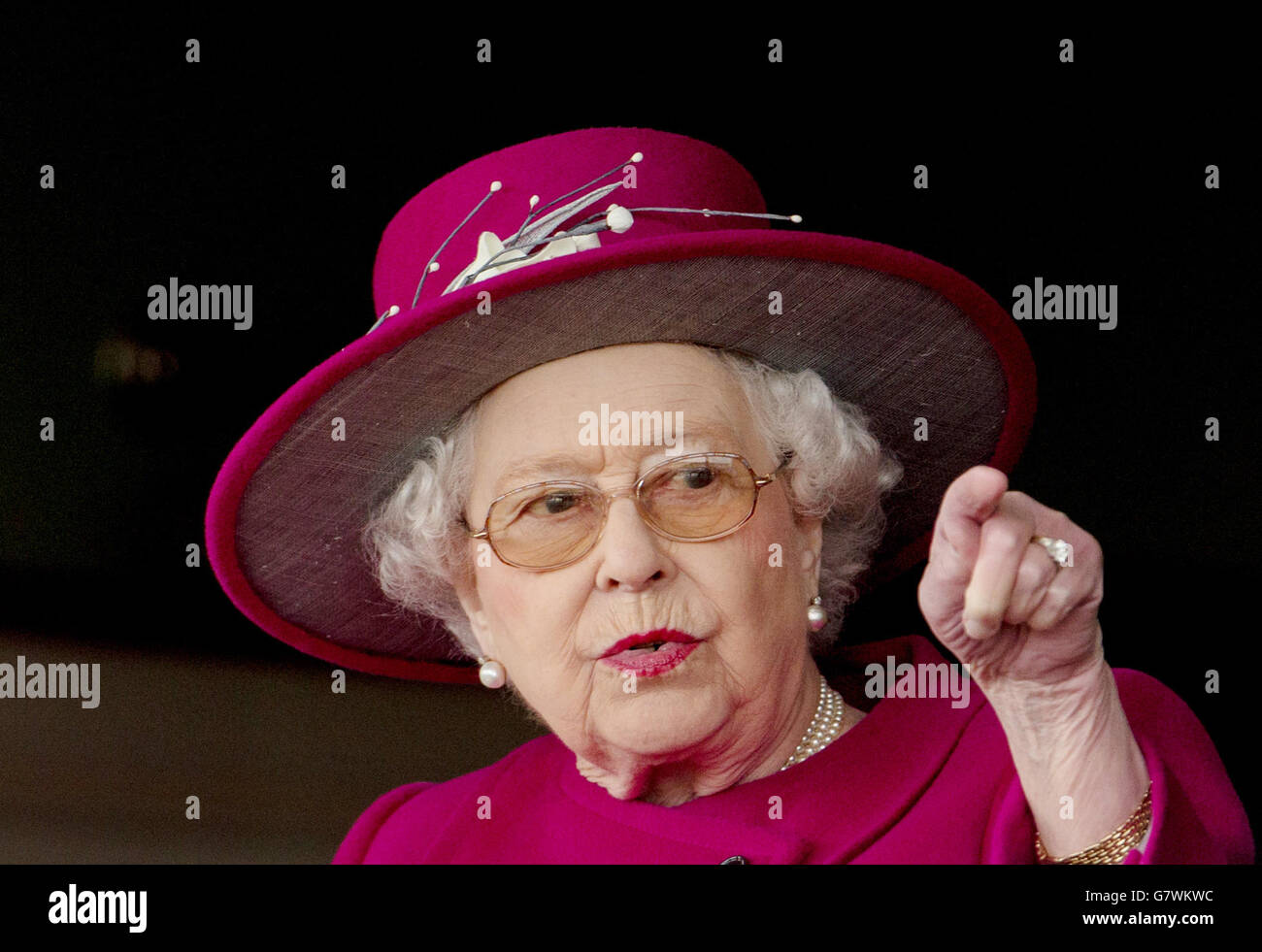 Queen Elizabeth II watches the horse racing at the Dubai Duty Free ...
