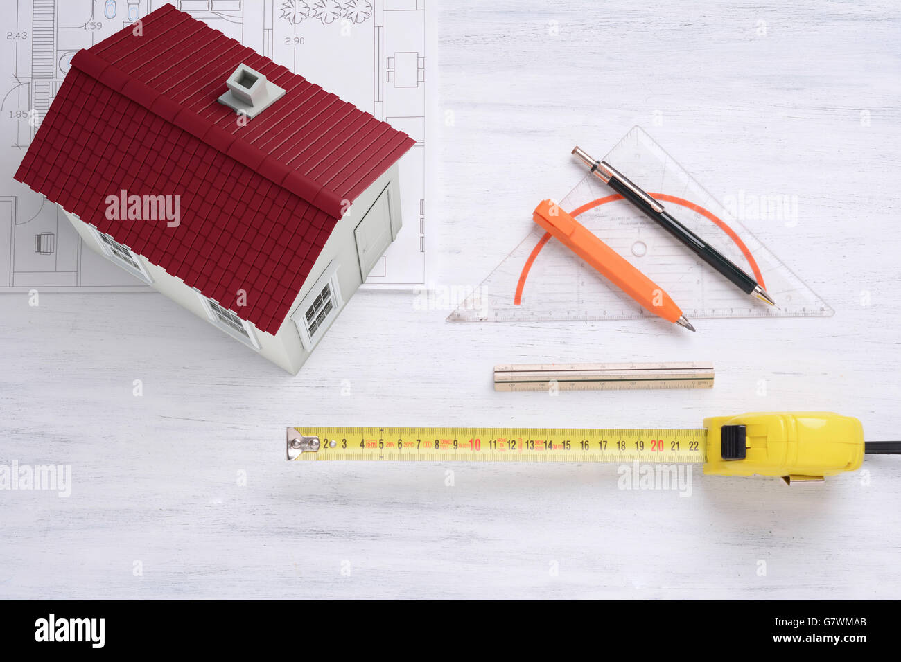 House with house plan and tools. Architecture Concept Stock Photo - Alamy