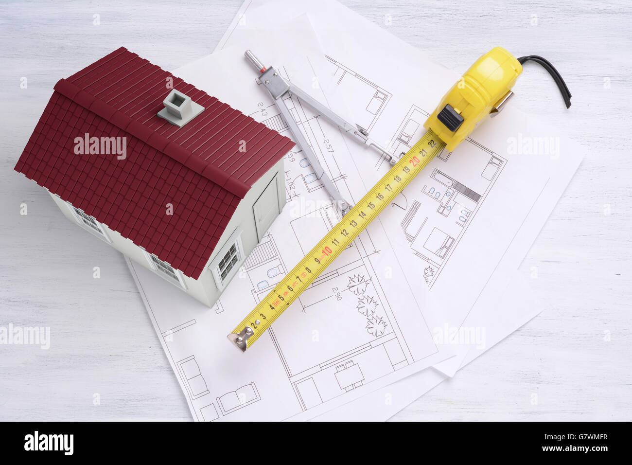 House with house plan and tools. Architecture Concept Stock Photo - Alamy