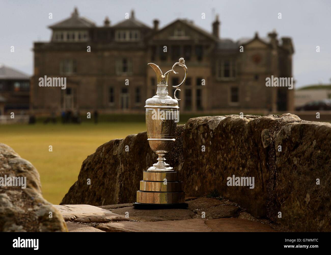 The Claret Jug trophy sits by the Swilcan Bridge in front of the ...