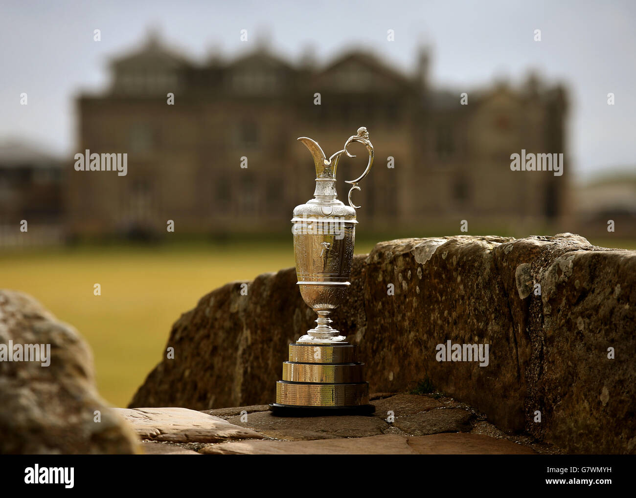 The Claret Jug trophy sits on the Swilcan Bridge in front of the ...