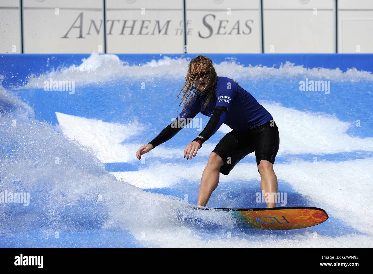 An instructor demonstrates the FlowRider wave machine onboard Royal ...